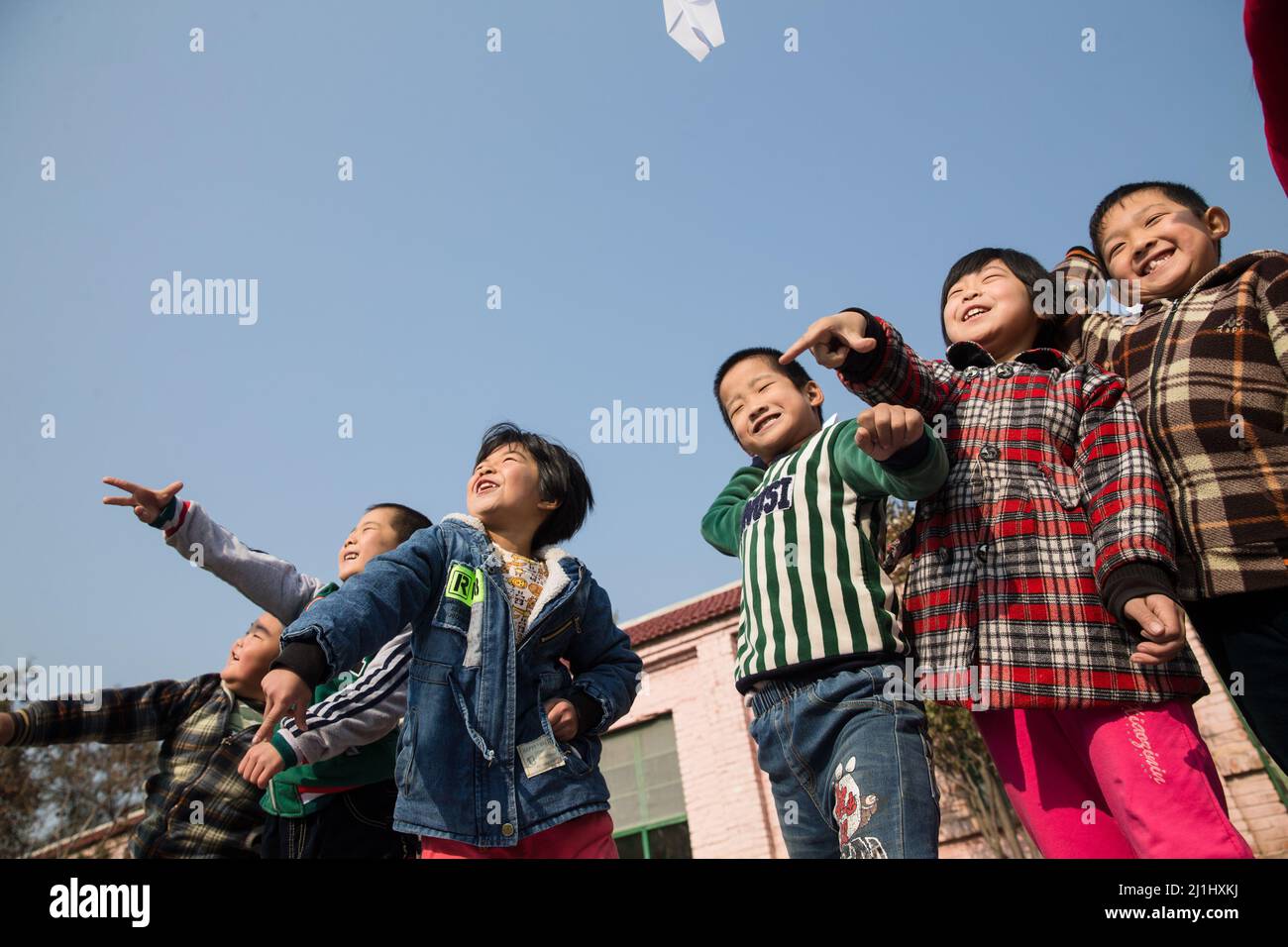 Rural primary school students in the school put a paper airplane Stock ...