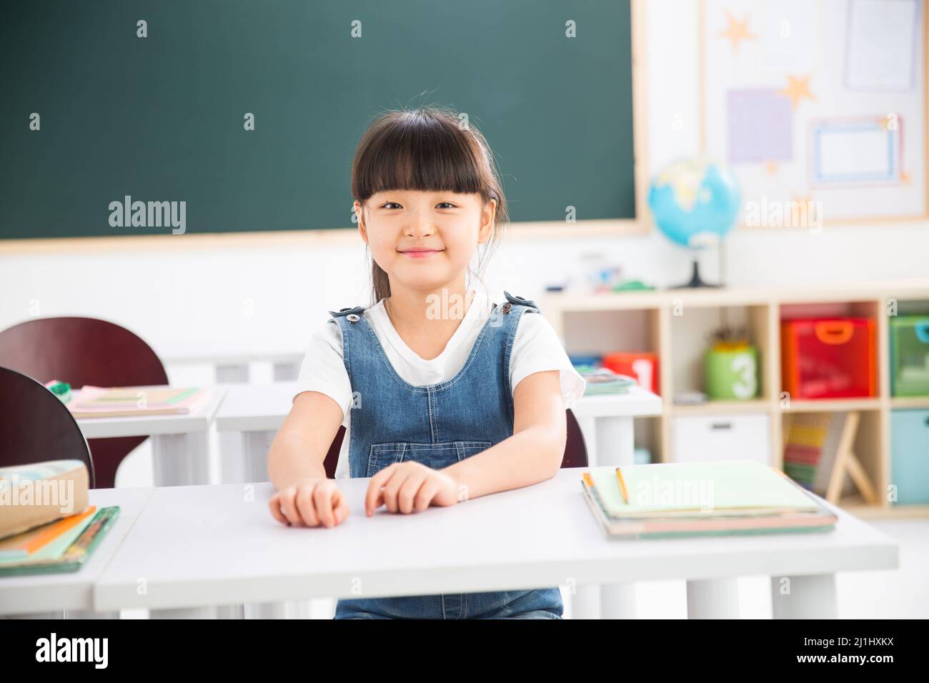 Primary school girls in the classroom Stock Photo - Alamy
