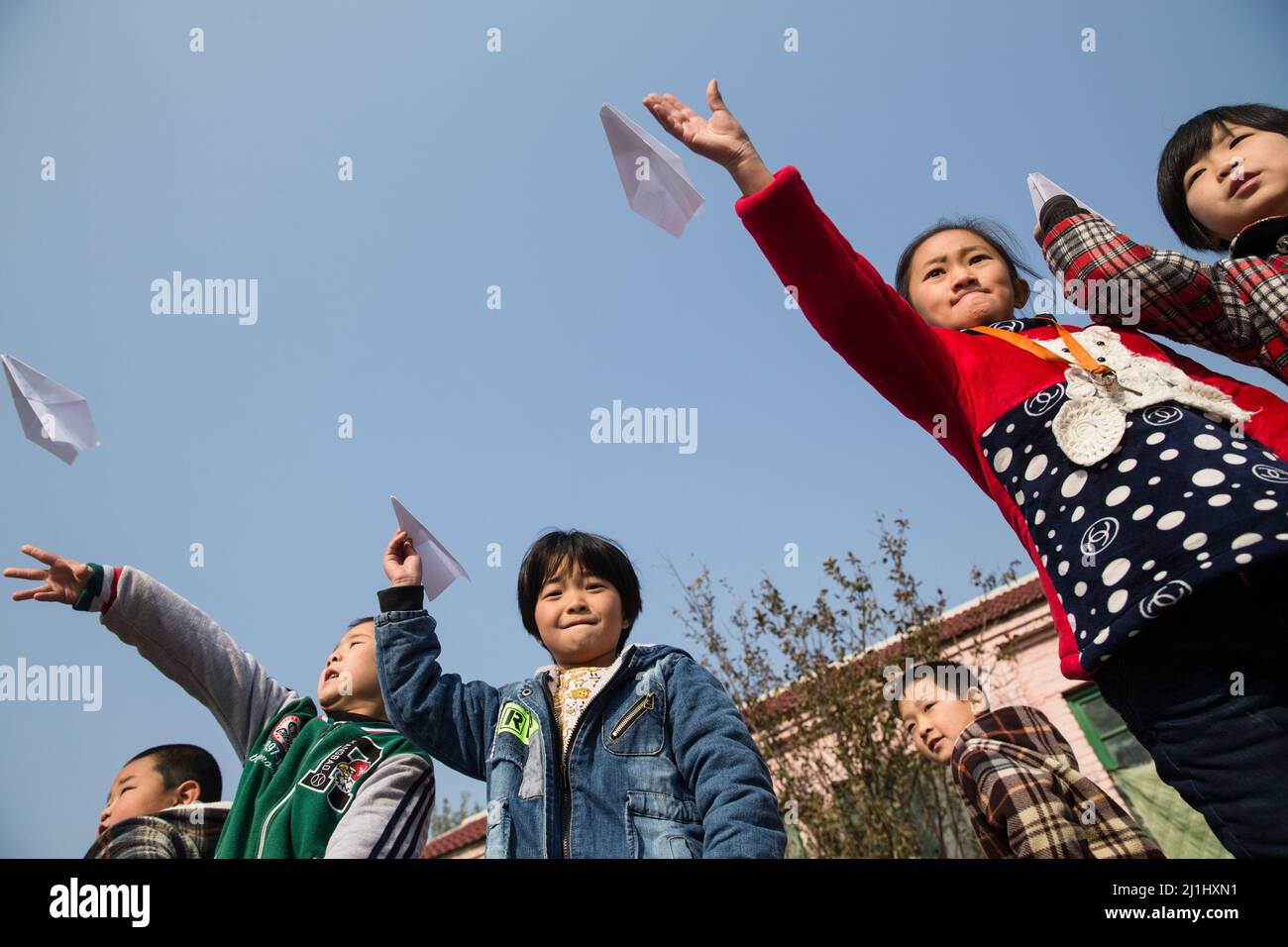 Rural primary school students in the school put a paper airplane Stock ...