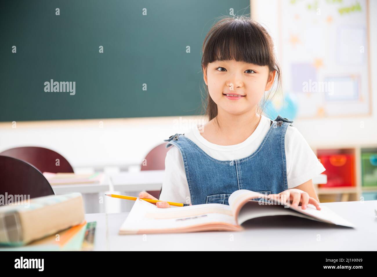 Primary school girls in the classroom Stock Photo - Alamy