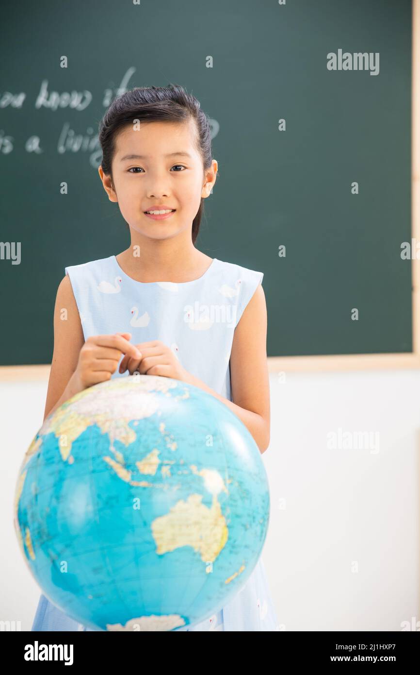 Primary school girls in the classroom Stock Photo - Alamy