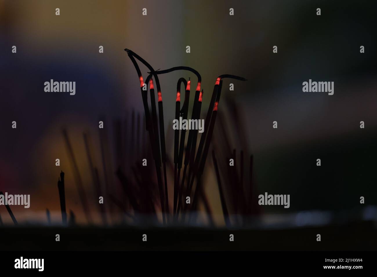 A heap of incense sticks, stuck in the ground, ember in twilight Stock ...