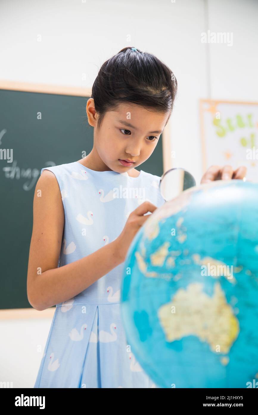 Primary school girls in the classroom Stock Photo - Alamy