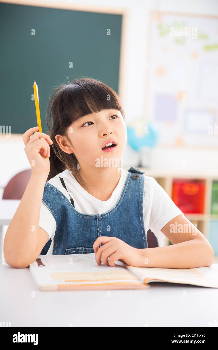 Primary school girls in the classroom Stock Photo - Alamy