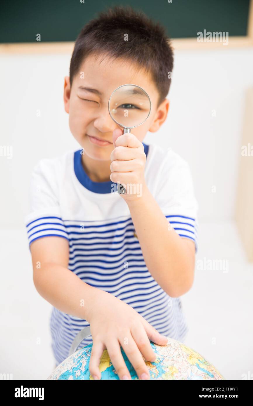 Primary school boy in the classroom Stock Photo - Alamy