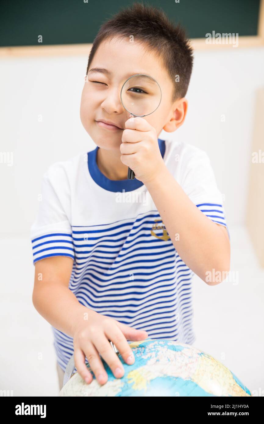 Primary school boy in the classroom Stock Photo - Alamy