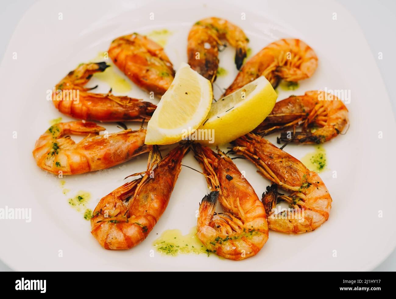 A gourmet portion of grilled prawns Stock Photo - Alamy