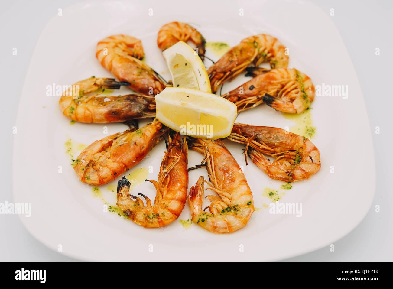 A gourmet portion of grilled prawns Stock Photo - Alamy