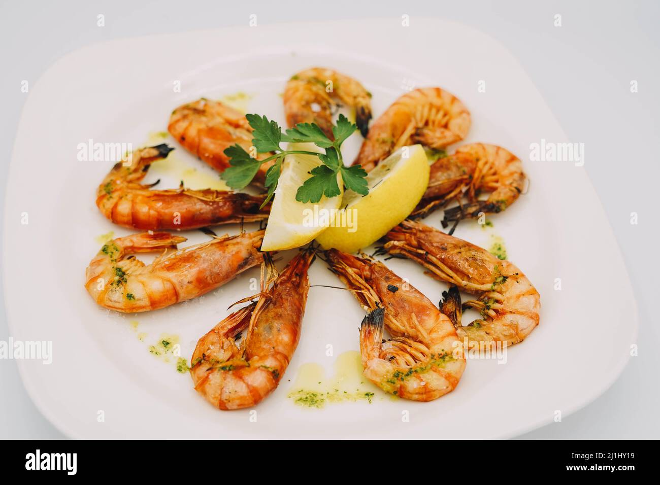 A gourmet portion of grilled prawns Stock Photo - Alamy