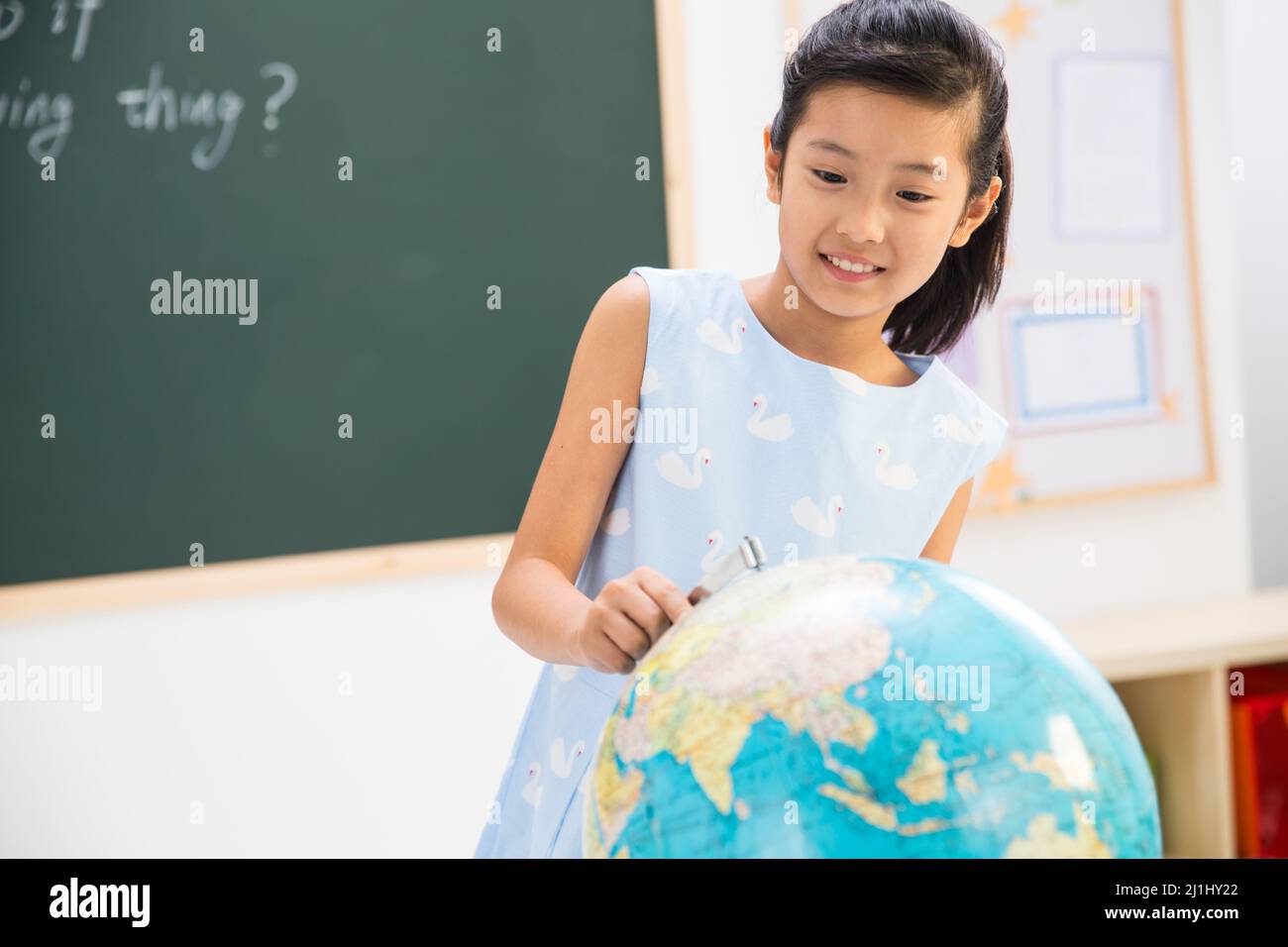 Primary school girls in the classroom Stock Photo - Alamy