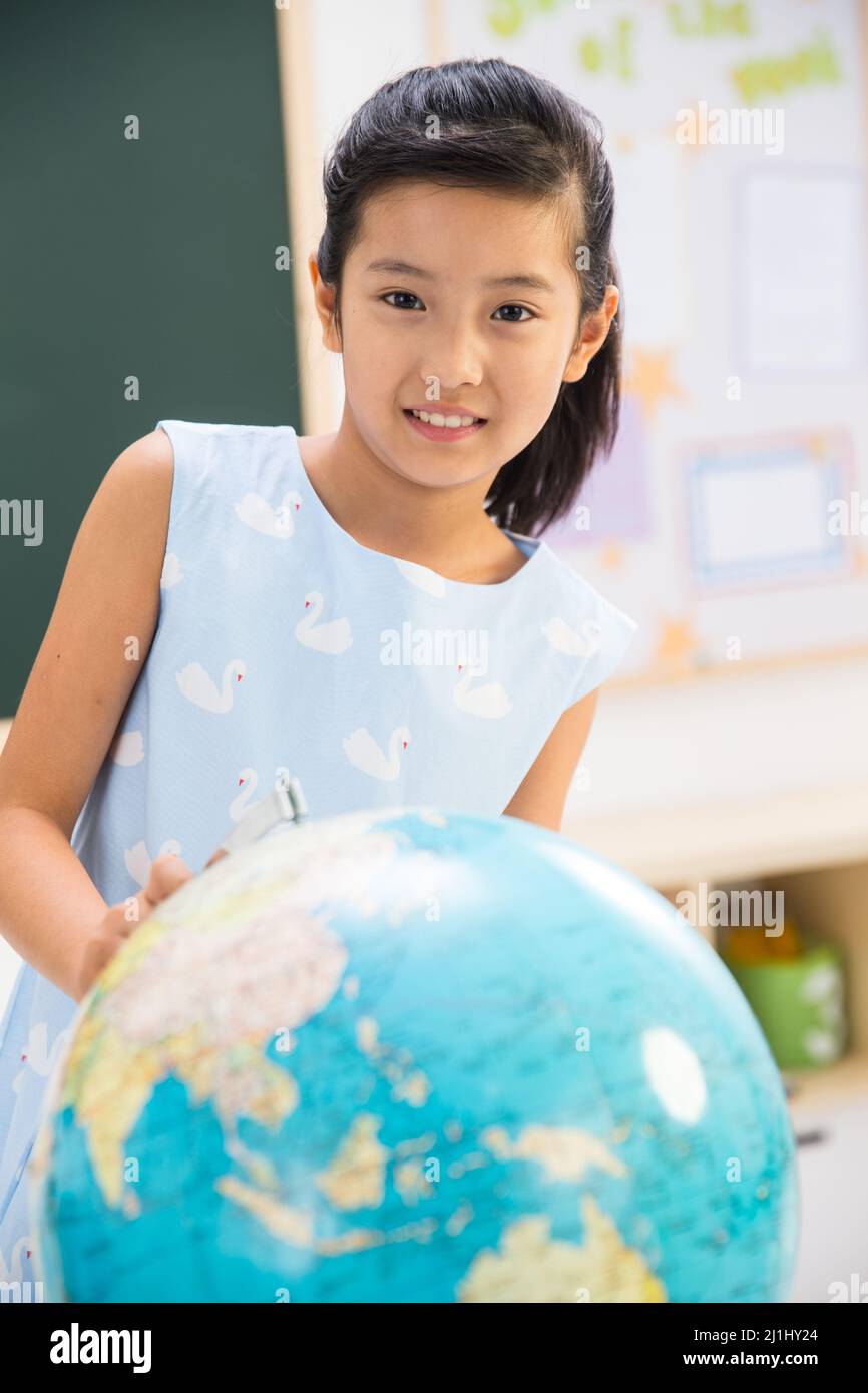Primary school girls in the classroom Stock Photo - Alamy