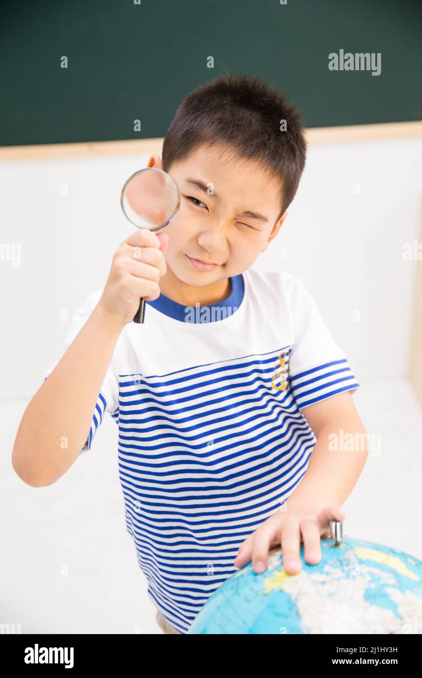 Primary school boy in the classroom Stock Photo - Alamy