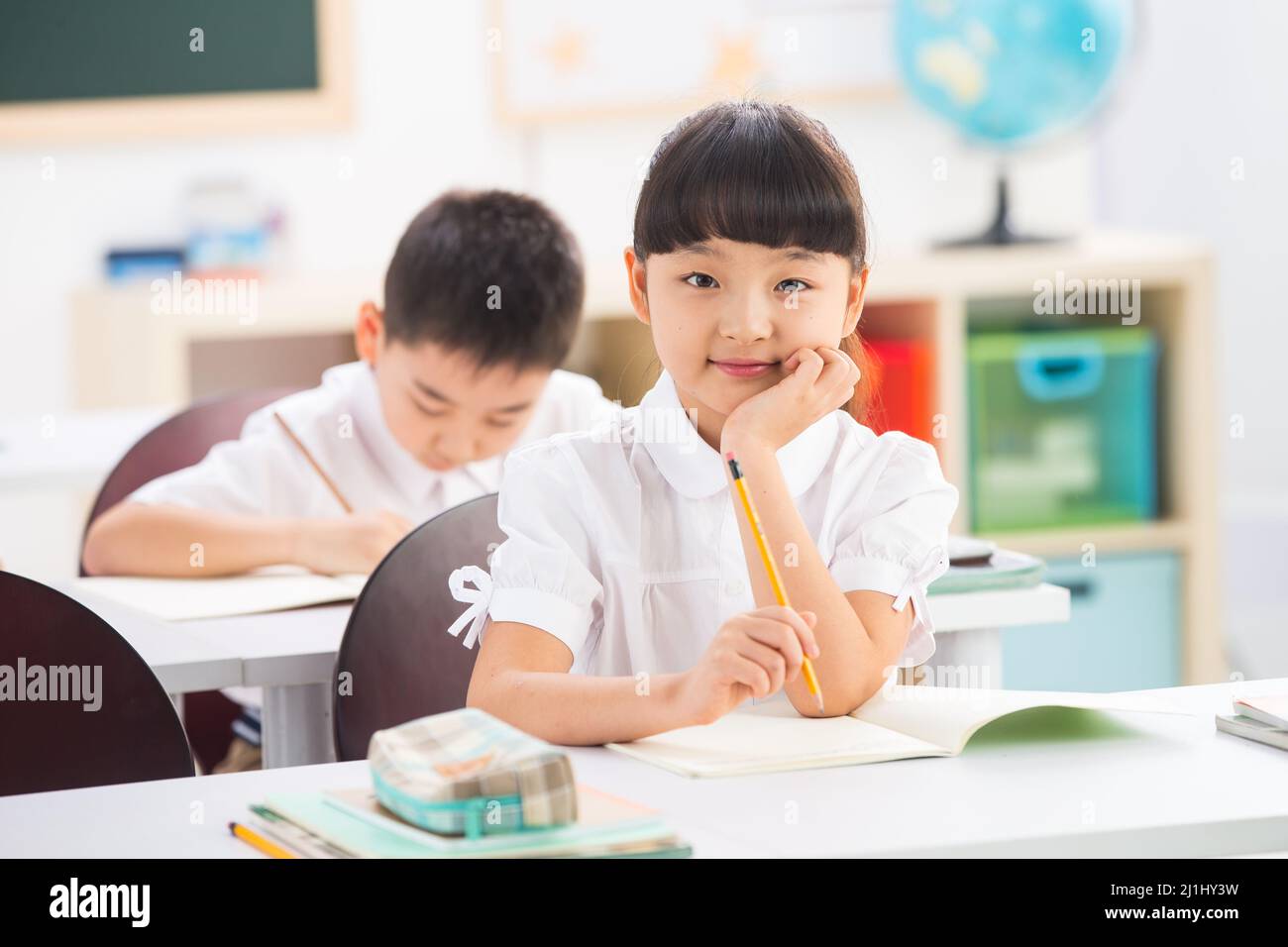 Elementary school students in class Stock Photo - Alamy