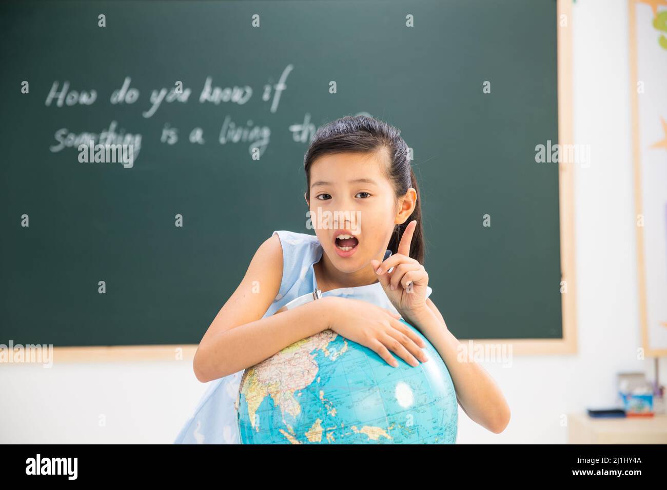 Primary school girls in the classroom Stock Photo - Alamy