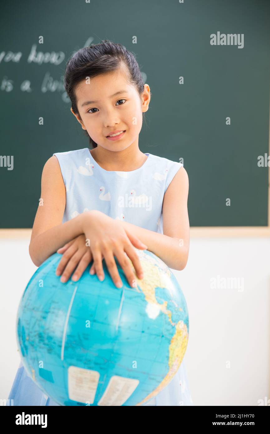 Primary school girls in the classroom Stock Photo - Alamy