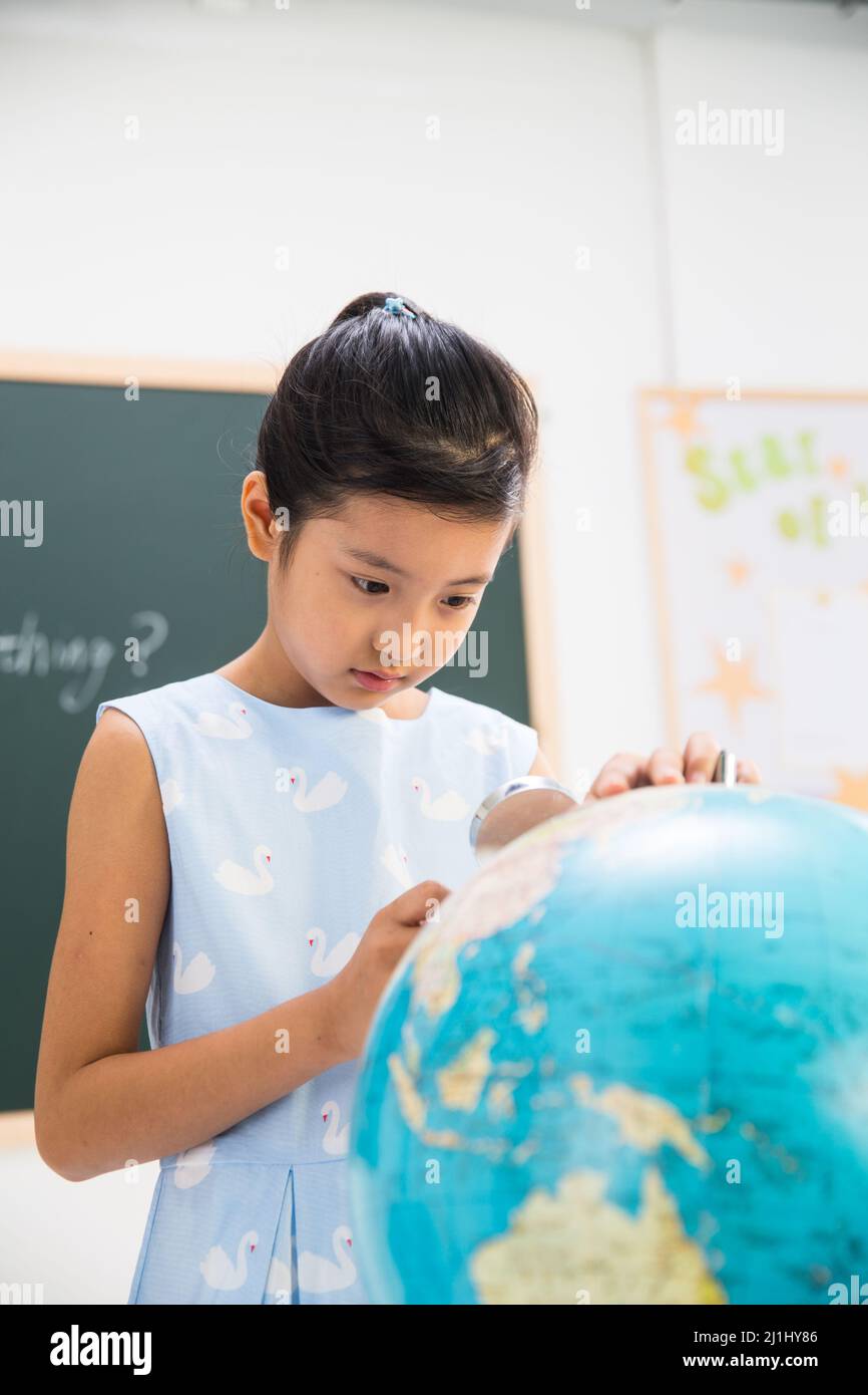 Primary school girls in the classroom Stock Photo - Alamy