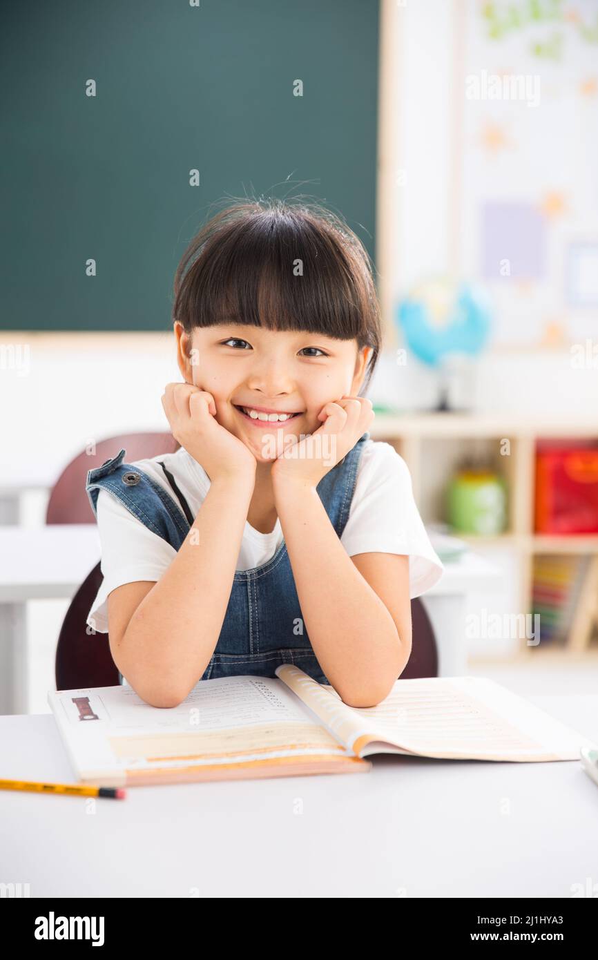 Primary school girls in the classroom Stock Photo - Alamy