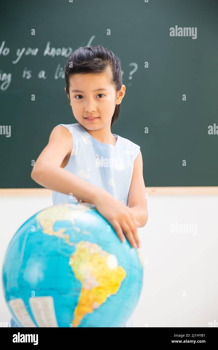 Primary school girls in the classroom Stock Photo - Alamy
