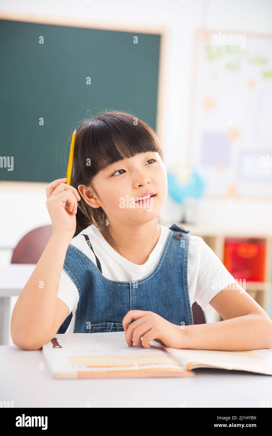 Primary school girls in the classroom Stock Photo - Alamy