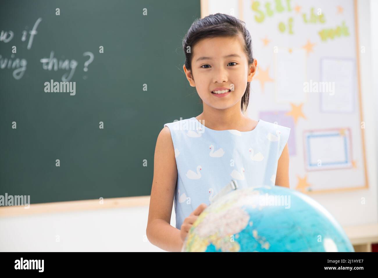 Primary school girls in the classroom Stock Photo - Alamy