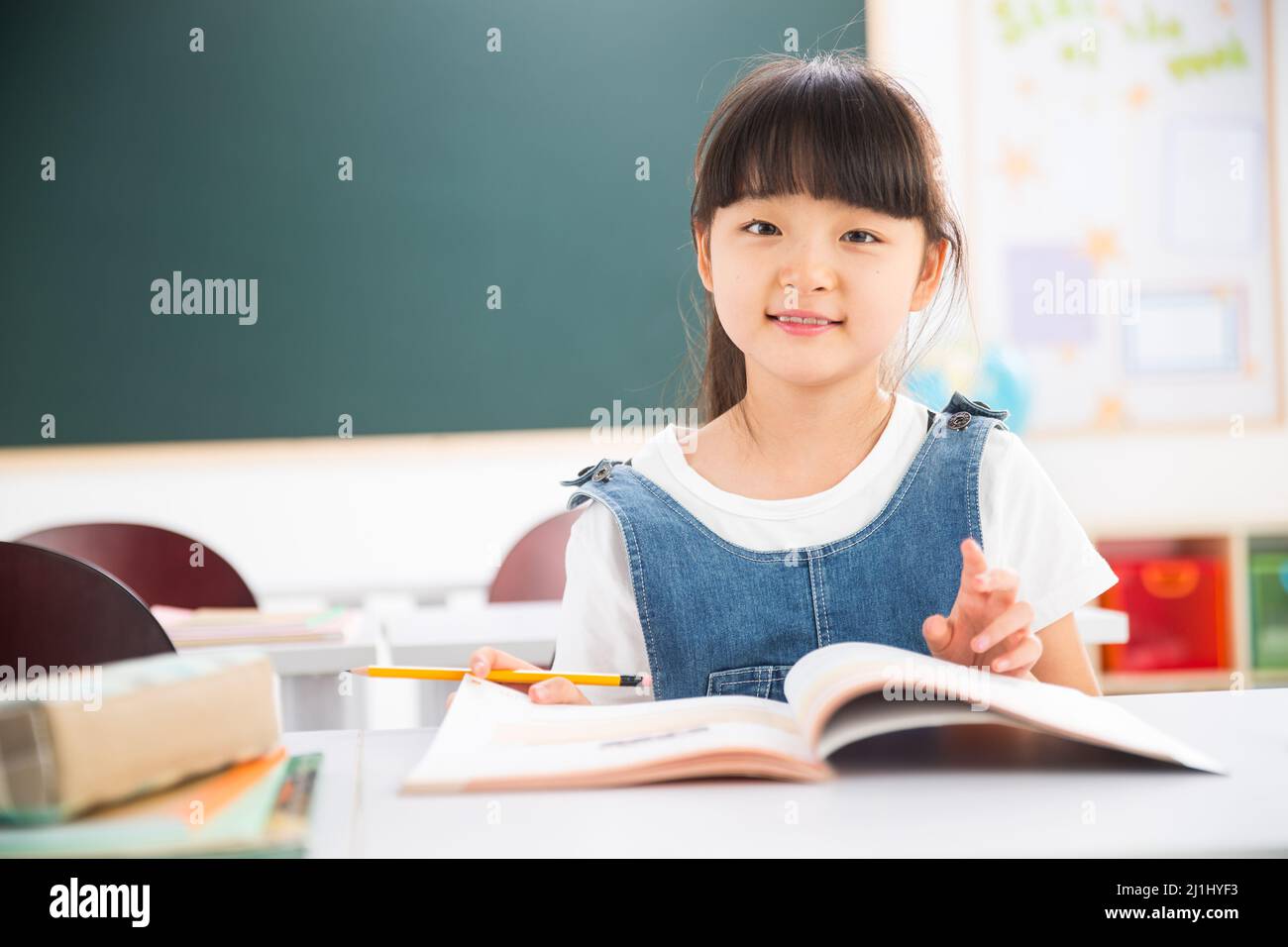 Primary school girls in the classroom Stock Photo - Alamy