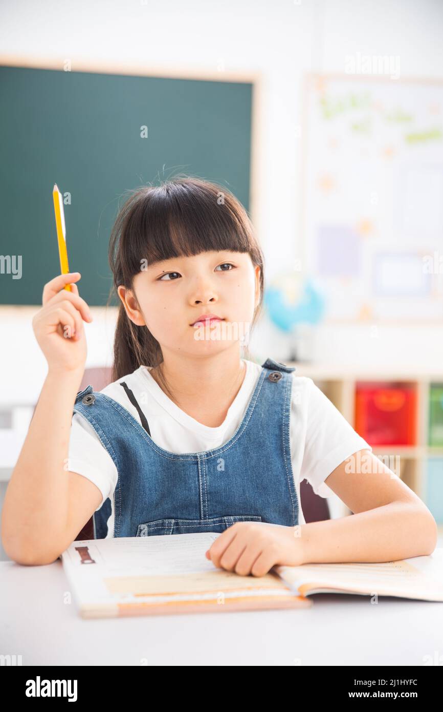 Primary school girls in the classroom Stock Photo - Alamy