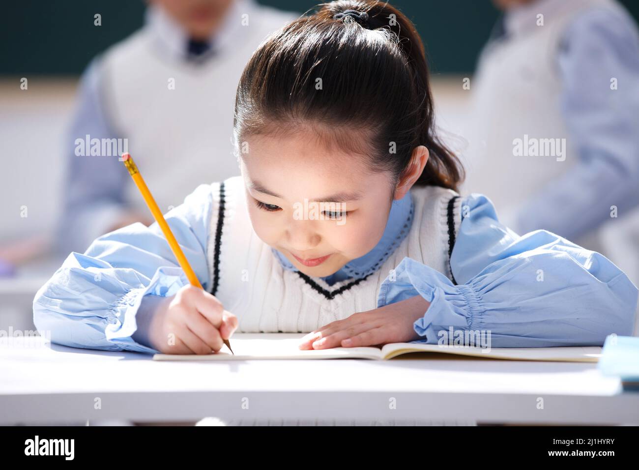 Elementary school students in class Stock Photo - Alamy