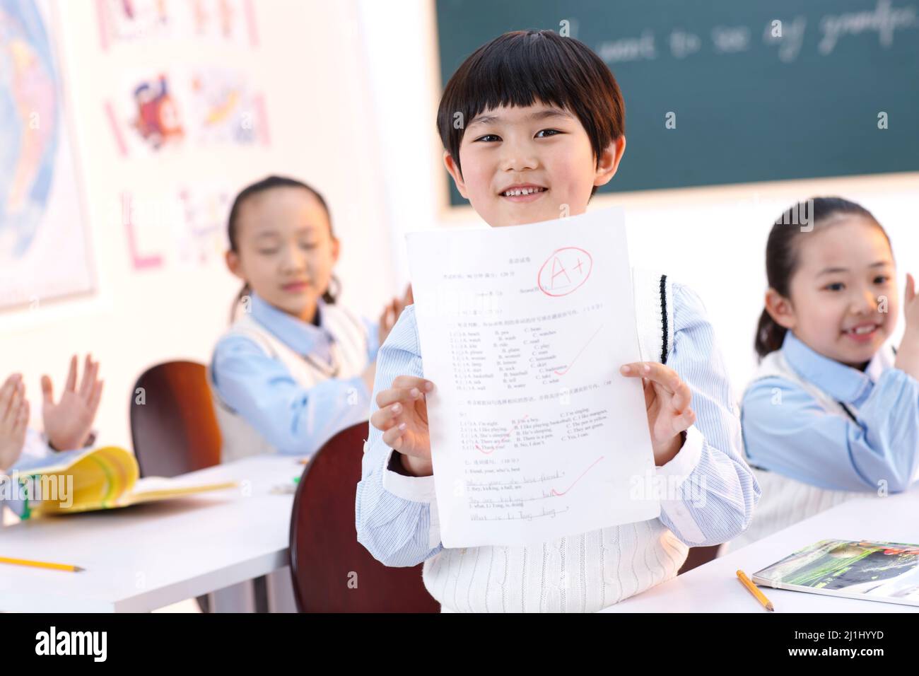 Children sitting exam school uniform hi-res stock photography and ...