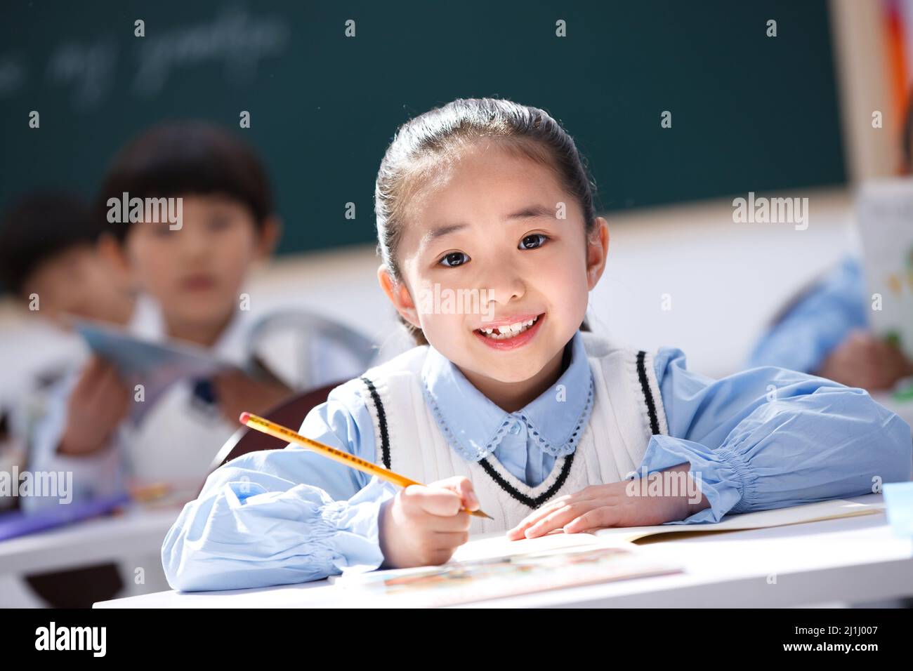Elementary school students in class Stock Photo - Alamy