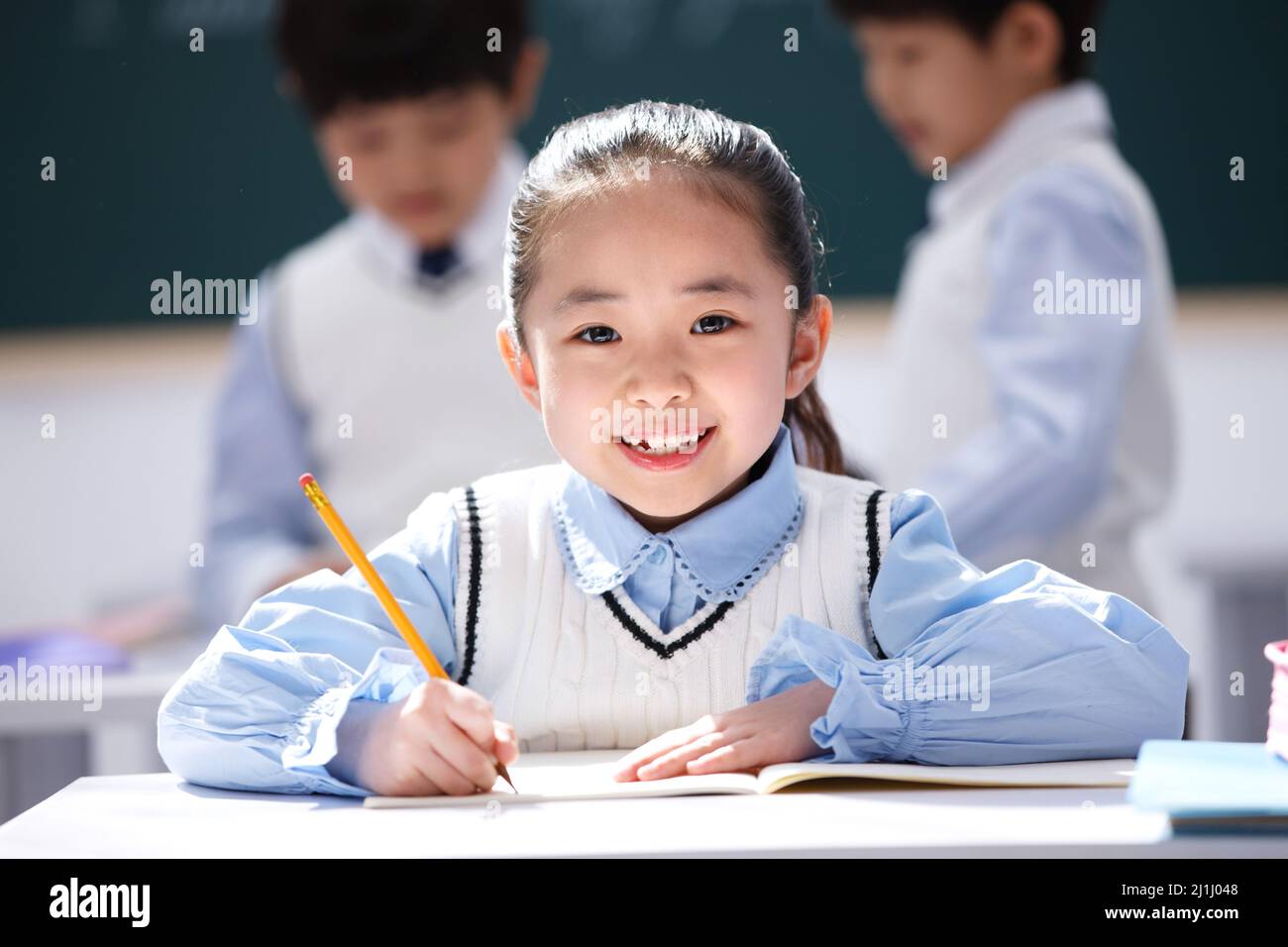Elementary school students in class Stock Photo - Alamy