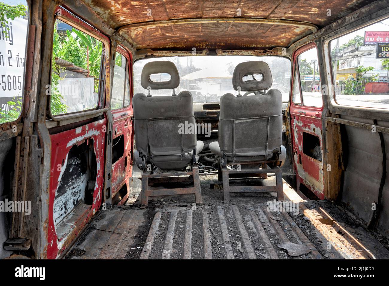 Interior of rusting Sherpa van discarded and abandoned on the side of ...