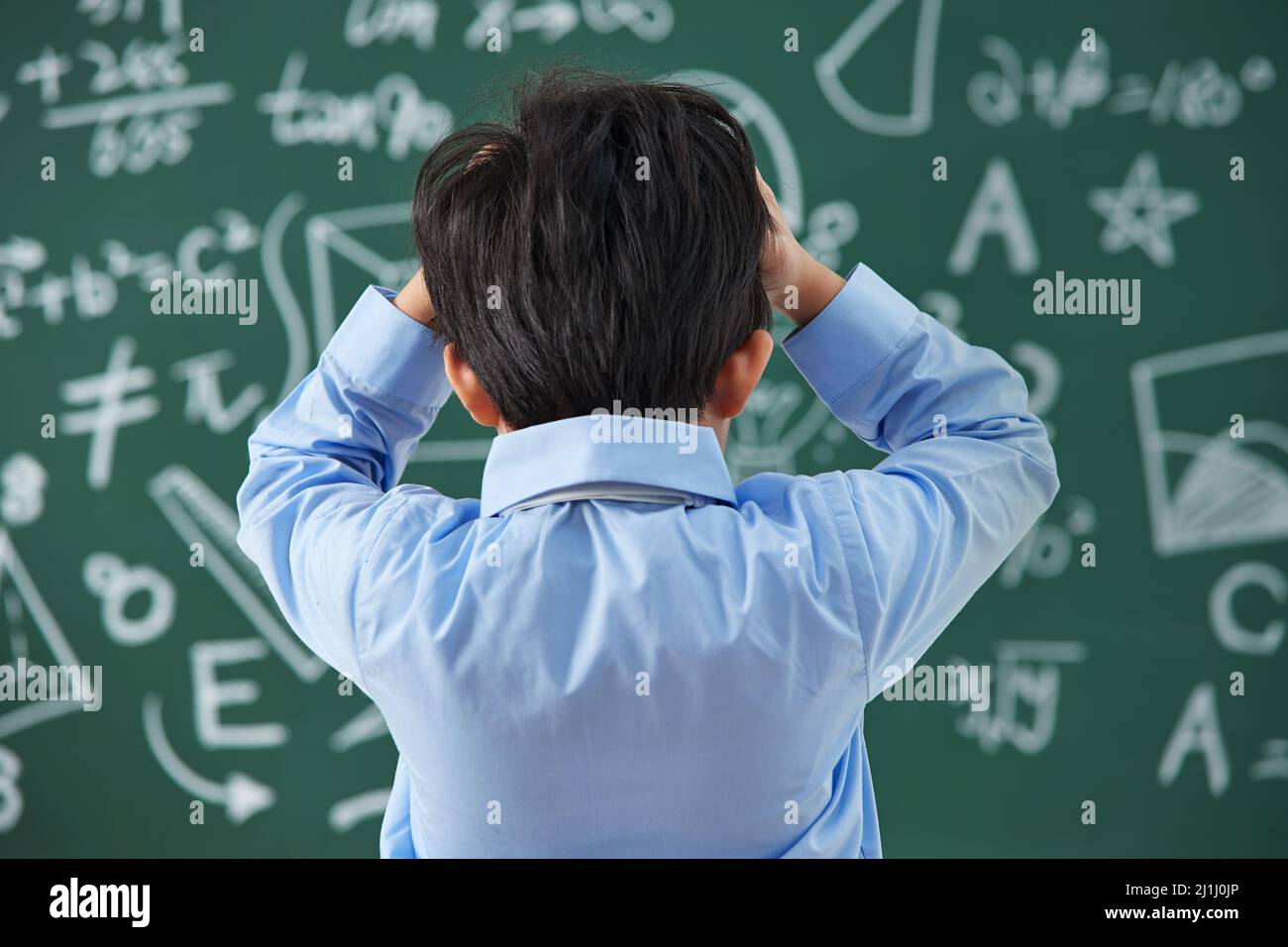 The back of elementary school boys were math problem difficult Stock ...