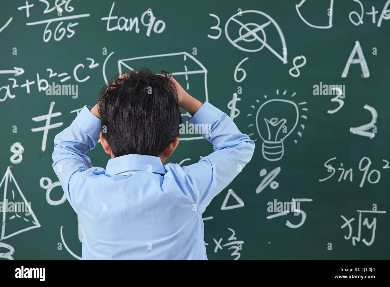 The back of elementary school boys were math problem difficult Stock ...