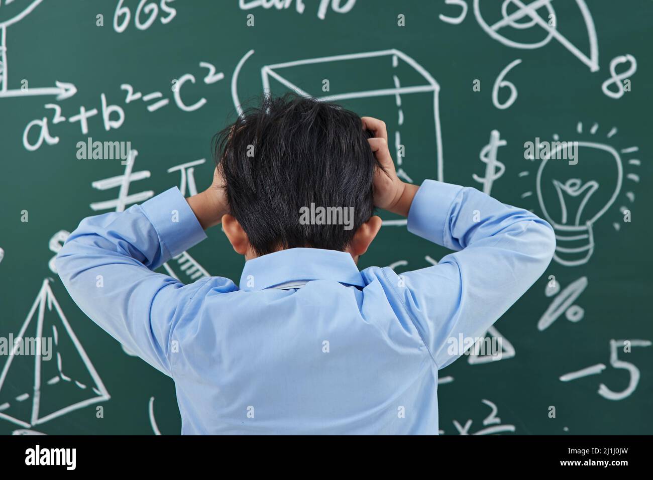 The back of elementary school boys were math problem difficult Stock Photo - Alamy