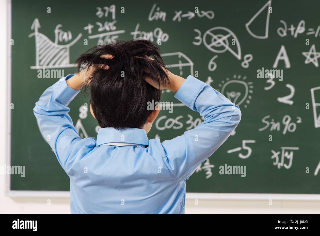 The back of elementary school boys were math problem difficult Stock ...