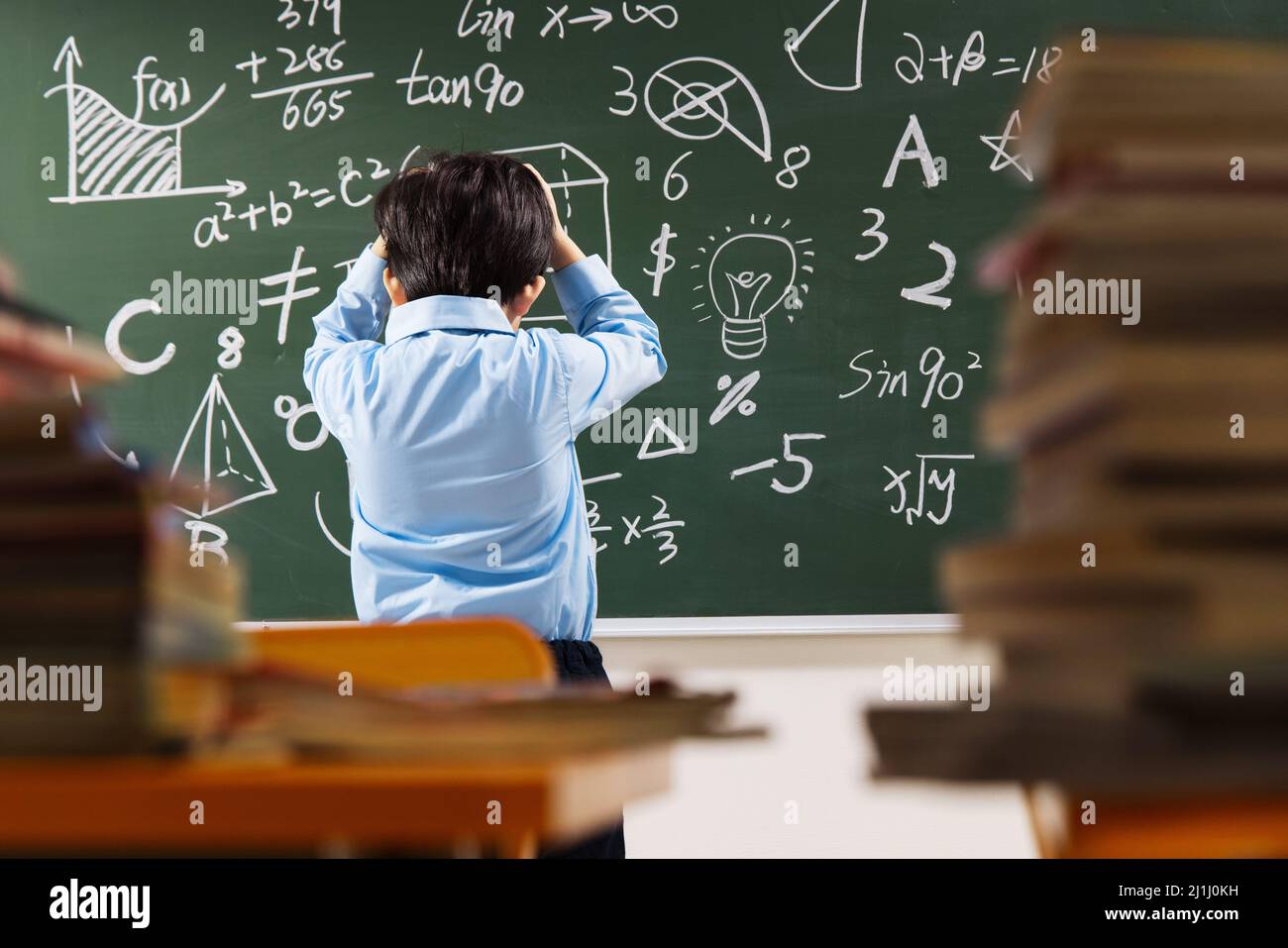 The back of elementary school boys were math problem difficult Stock ...