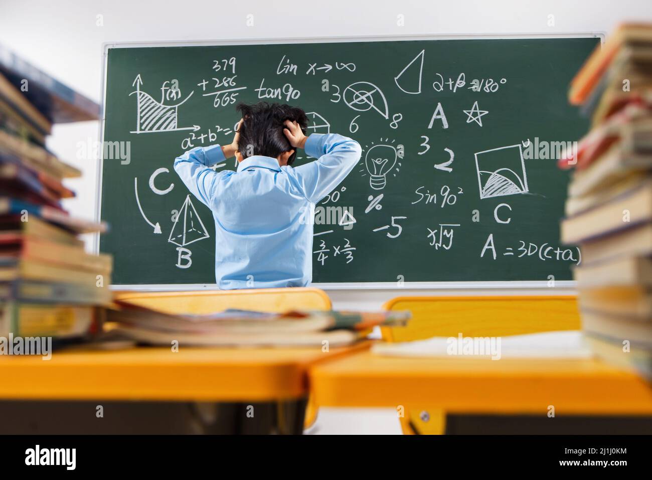 The back of elementary school boys were math problem difficult Stock ...