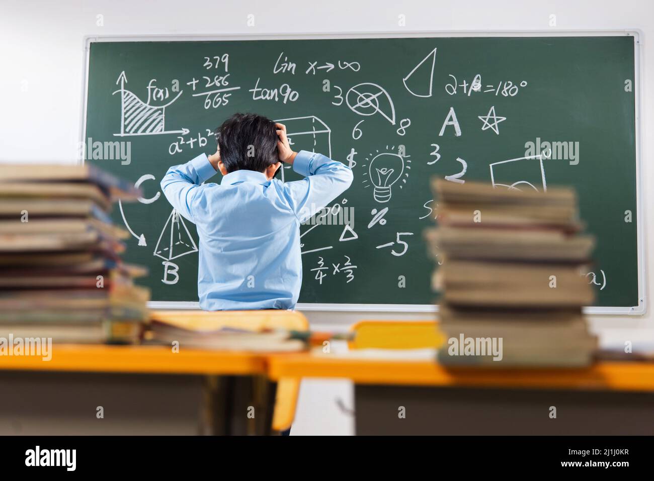 The back of elementary school boys were math problem difficult Stock ...