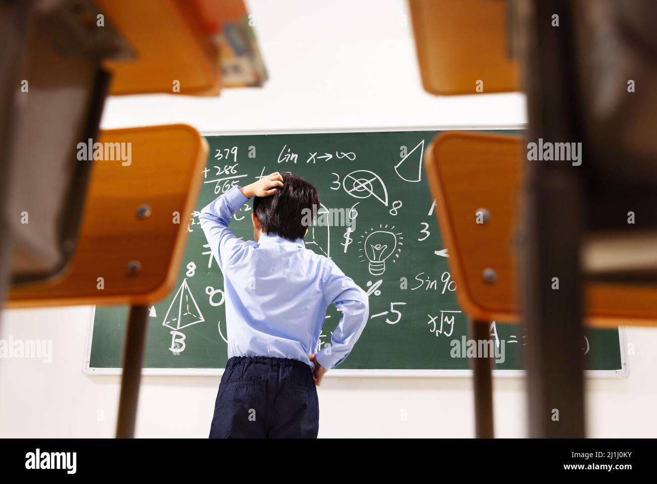 The back of elementary school boys were math problem difficult Stock ...