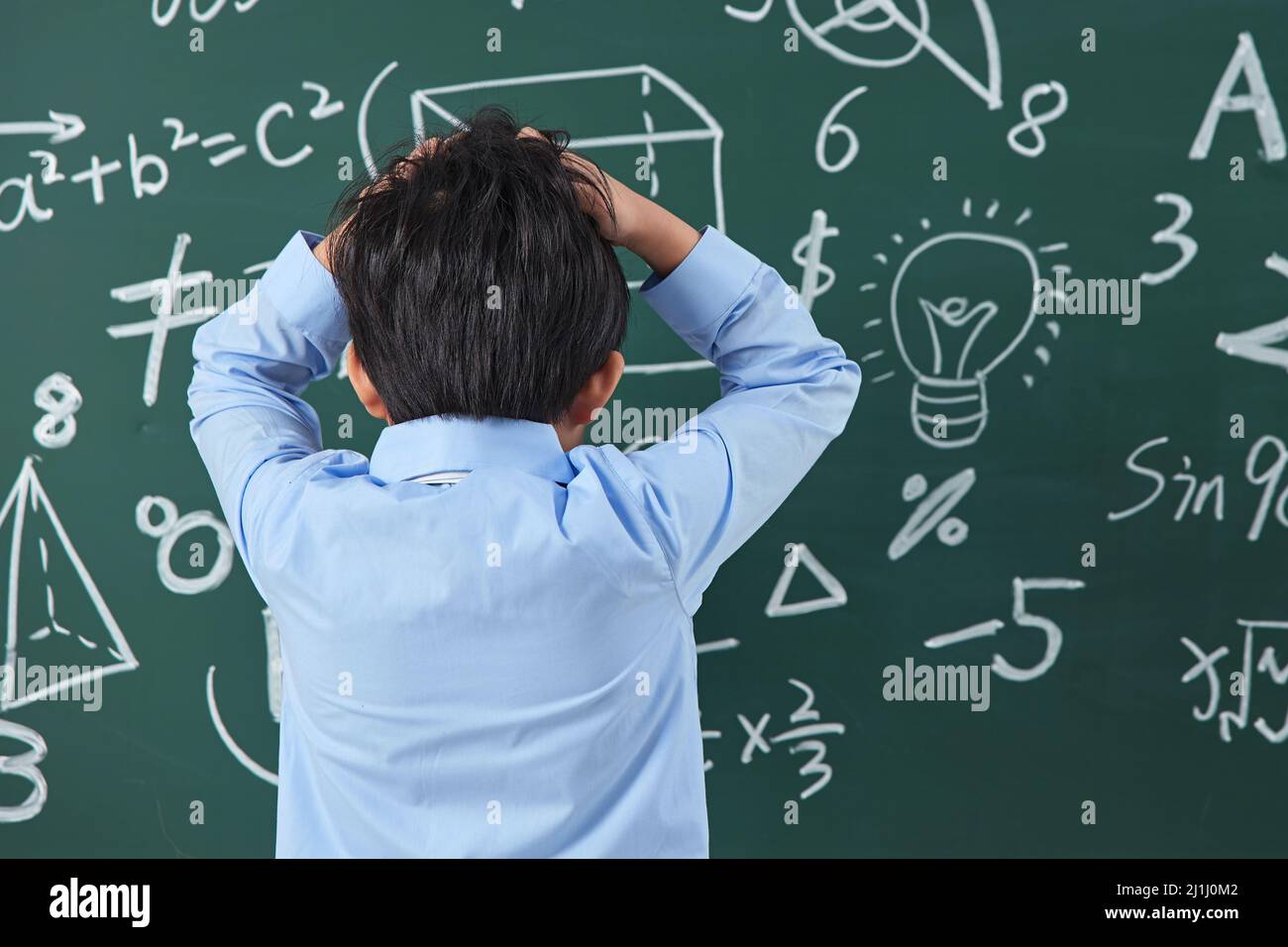 The back of elementary school boys were math problem difficult Stock ...