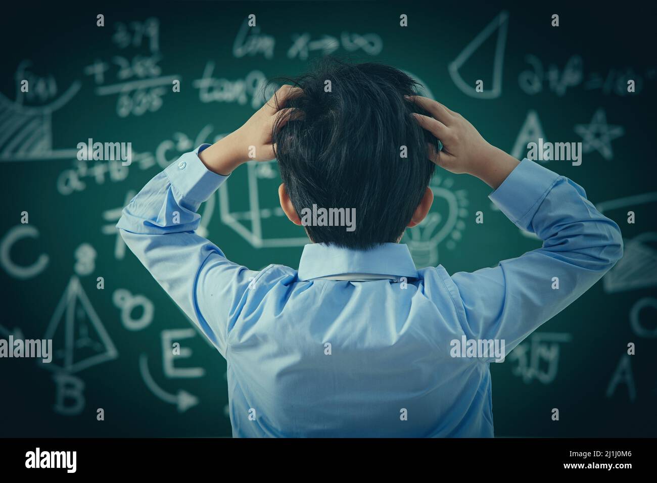 The back of elementary school boys were math problem difficult Stock ...