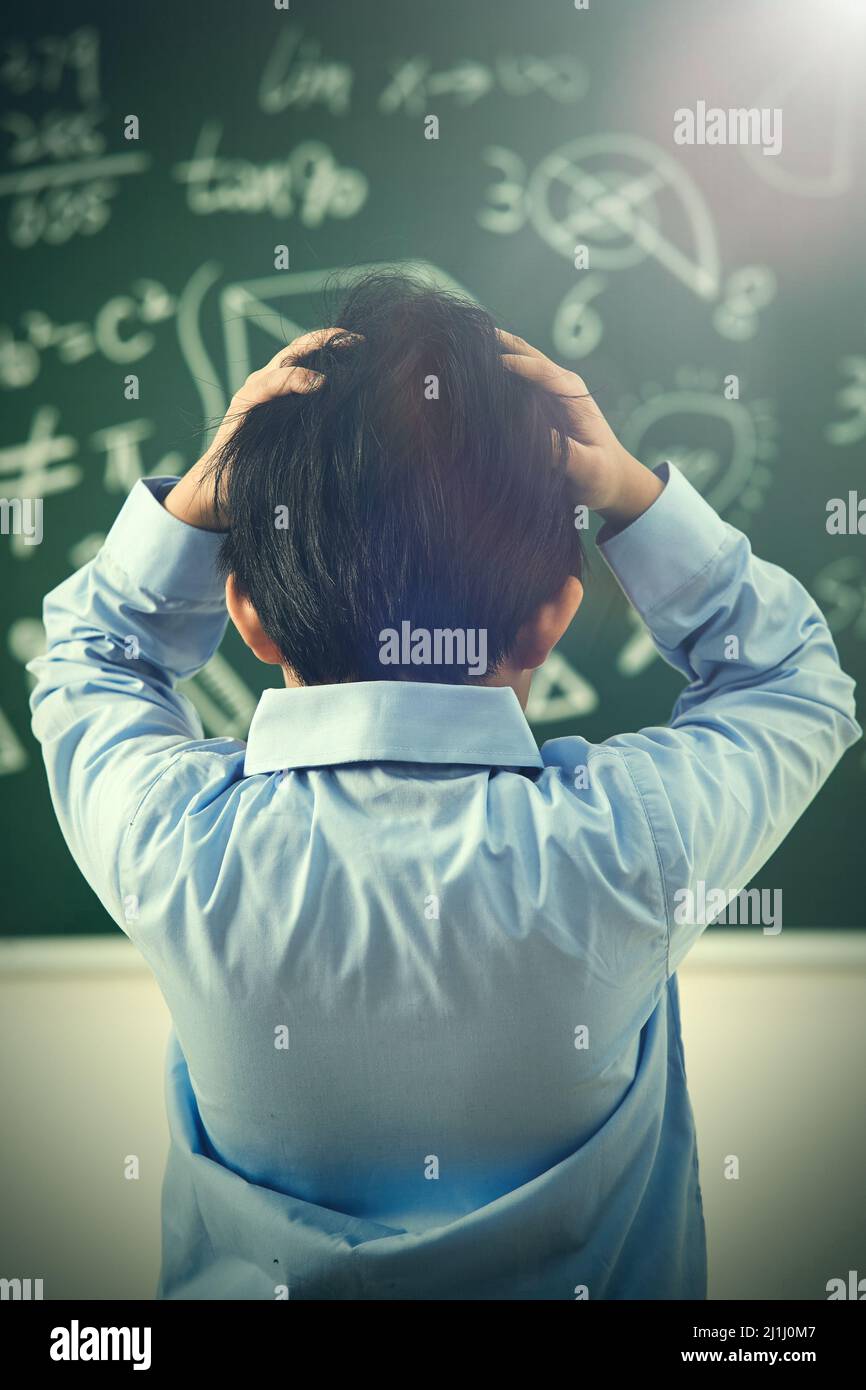 The back of elementary school boys were math problem difficult Stock ...