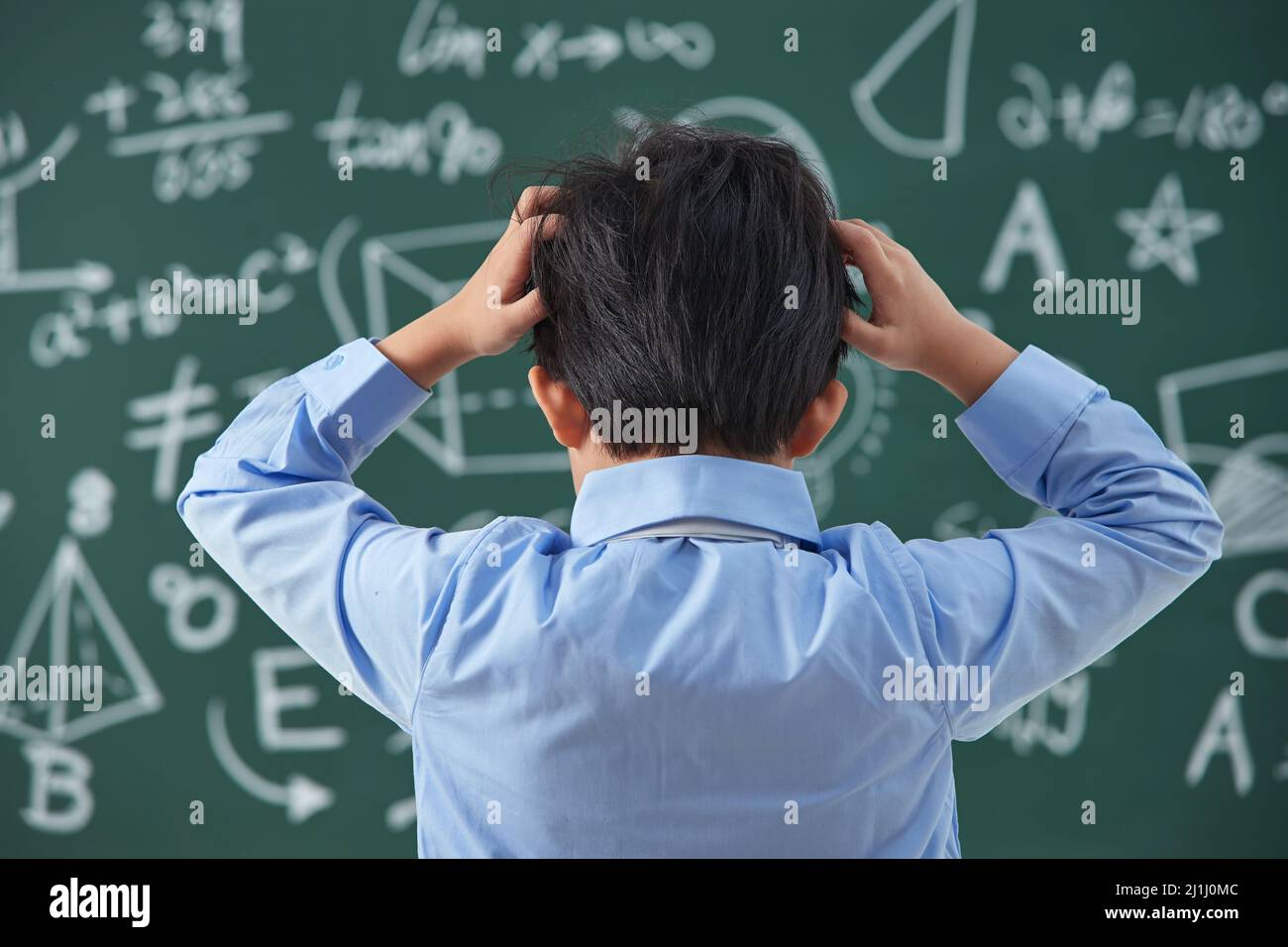 The back of elementary school boys were math problem difficult Stock ...