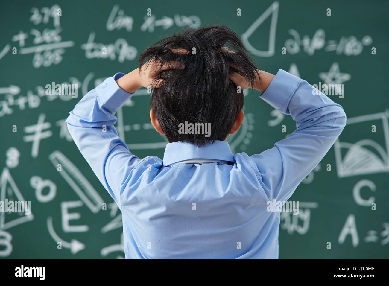 The back of elementary school boys were math problem difficult Stock ...