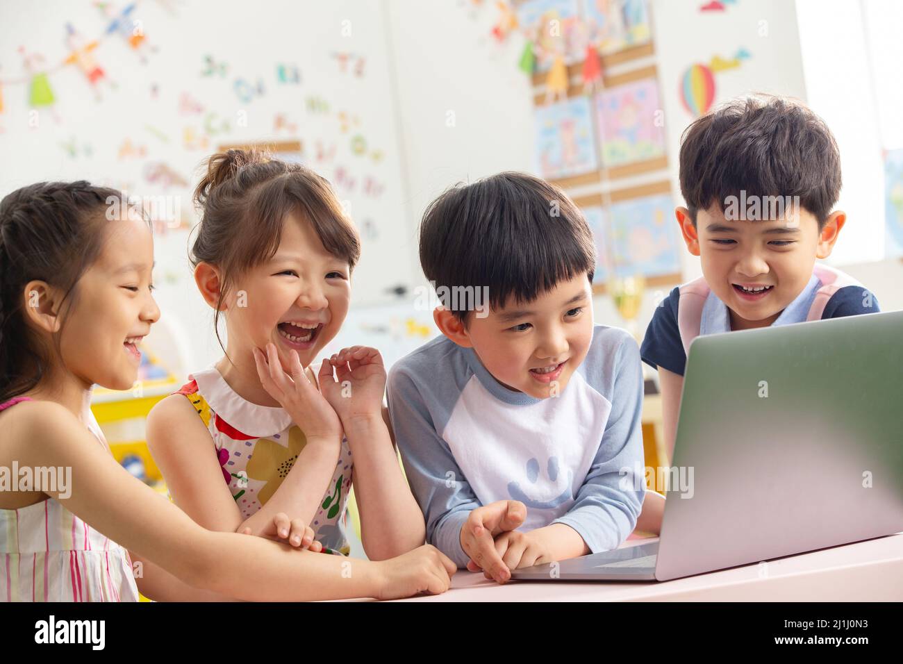 The kindergarten children watch video Stock Photo - Alamy