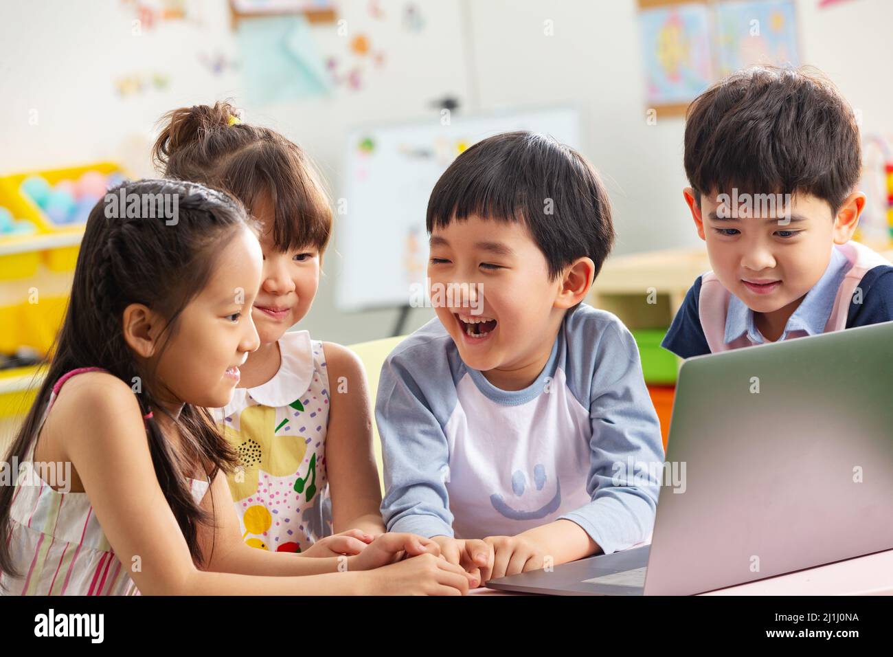 The kindergarten children watch video Stock Photo - Alamy
