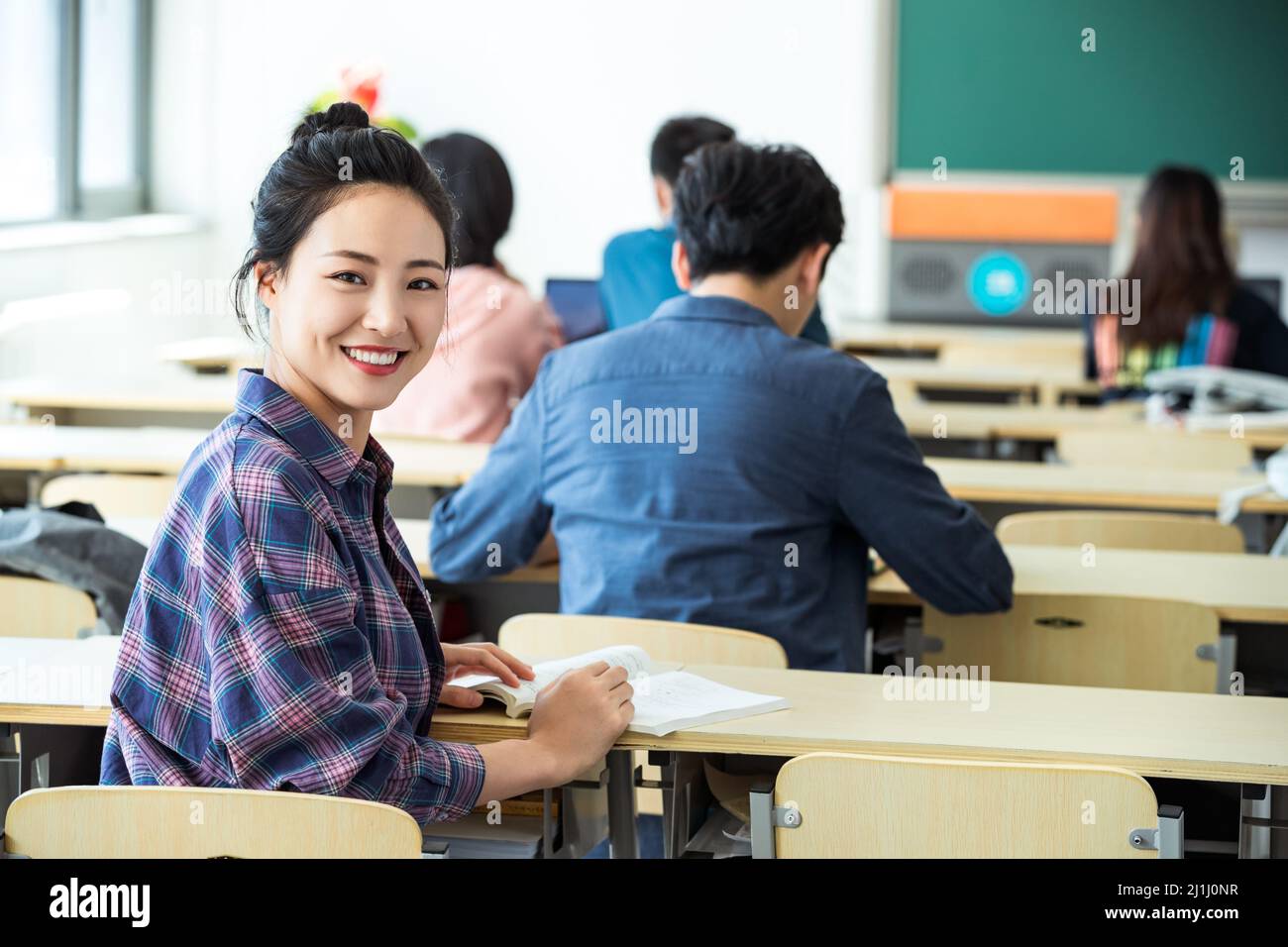 Classroom in class of college students look back Stock Photo - Alamy