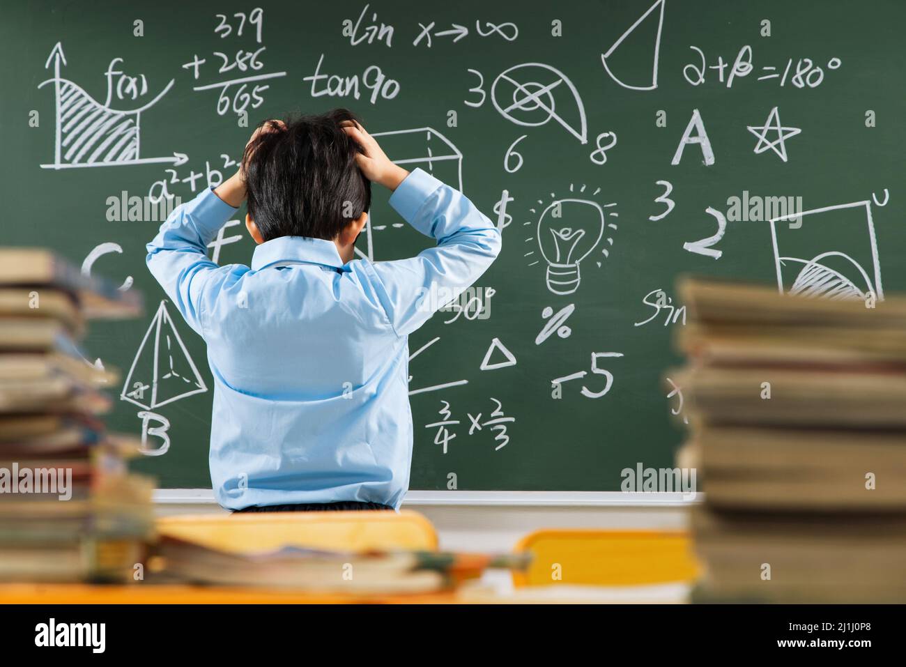 The back of elementary school boys were math problem difficult Stock ...