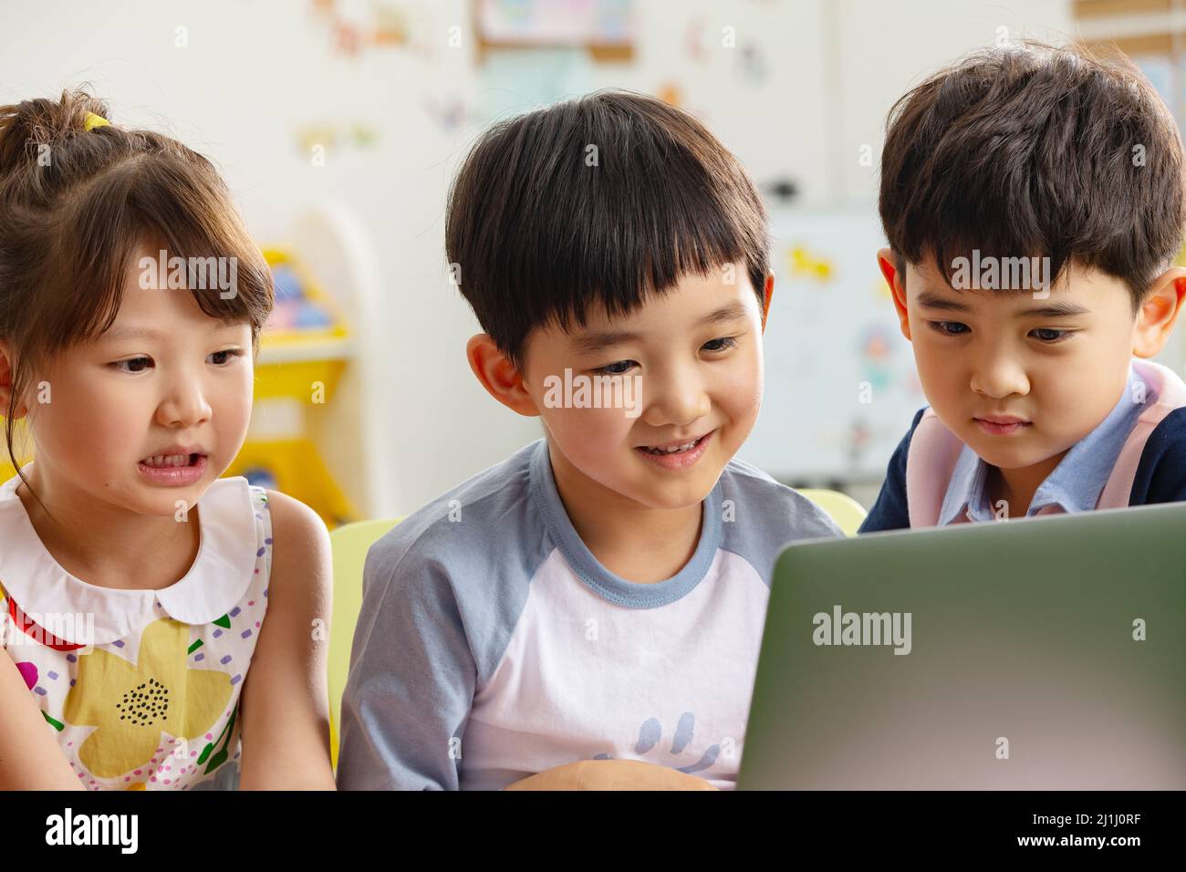The kindergarten children watch video Stock Photo - Alamy