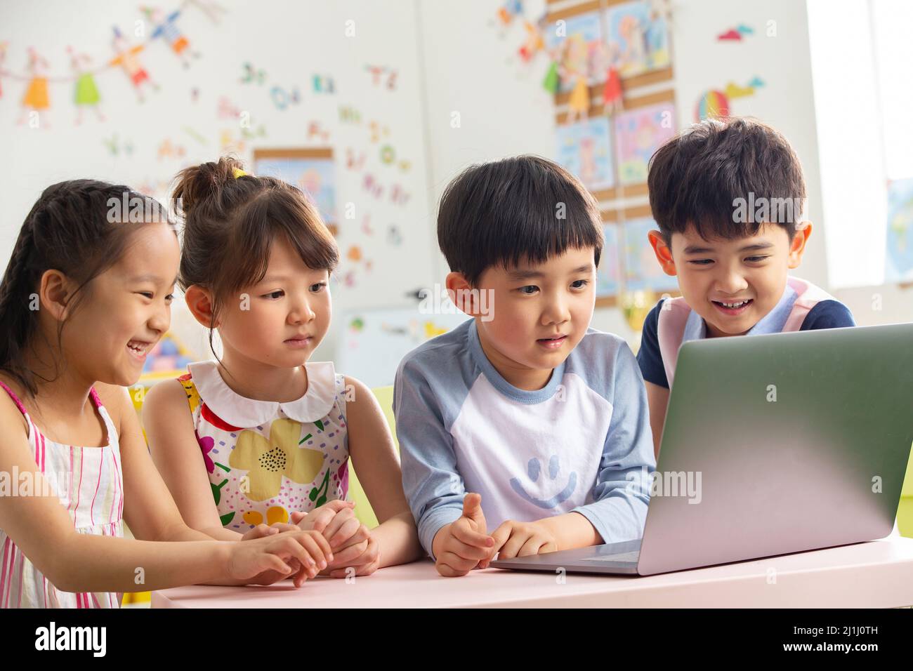 The kindergarten children watch video Stock Photo - Alamy
